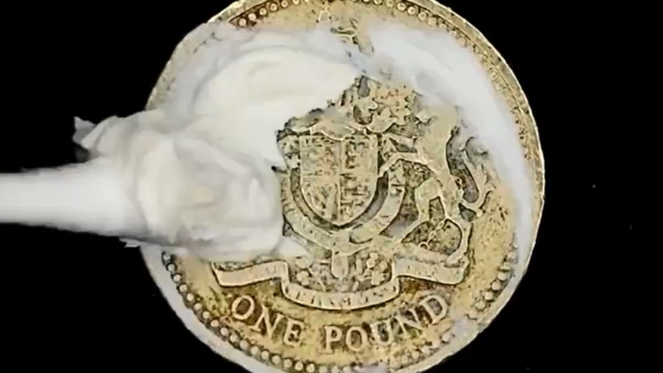 Coin transformed from dull to shiny after cleaning, video is oddly ...